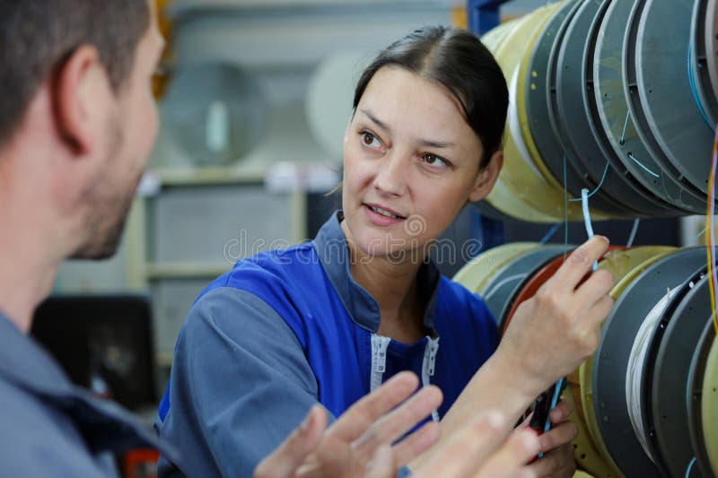 Electricians Talking Next To Wire Roll Stock Image - Image of wired ...