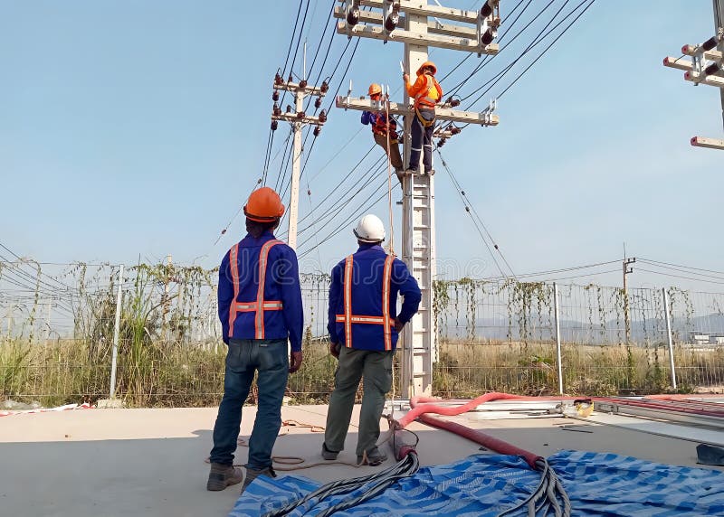 Electricians Working on the Electric Post Power Pole. Stock Image ...