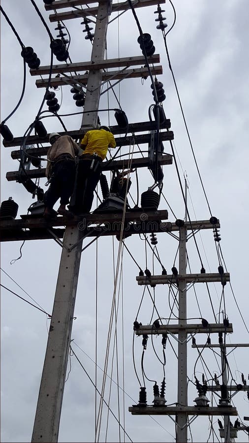 Electricians Working on the Electric Post Power Pole. Stock Photo ...