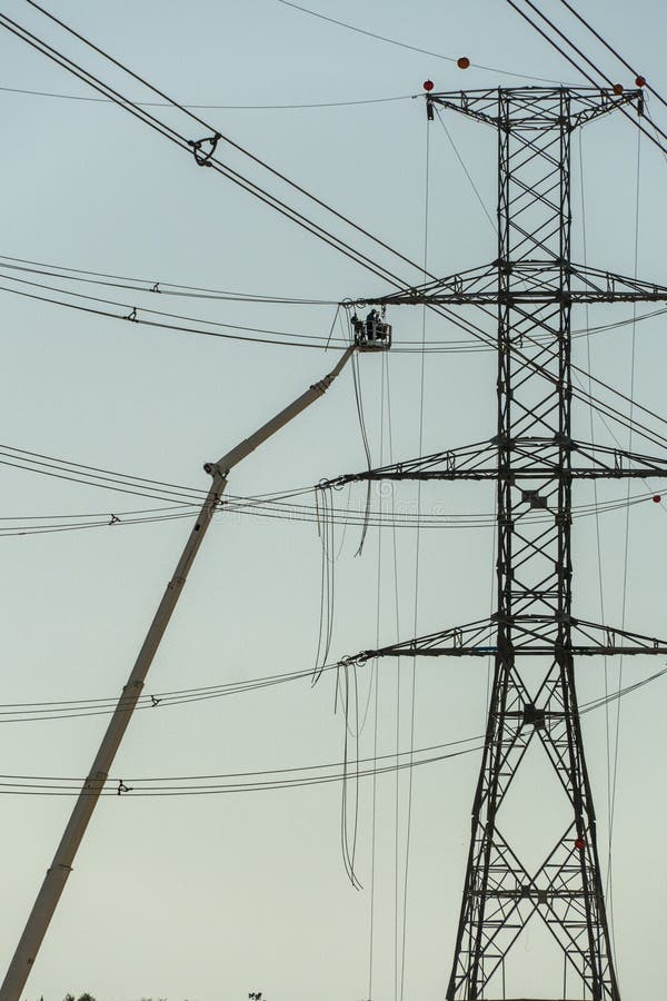 Electricians are Working on New Electrical Lines_ Stock Photo - Image ...