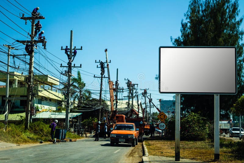 Electricians Working on a Power Pole, Filled with Complex Communication ...