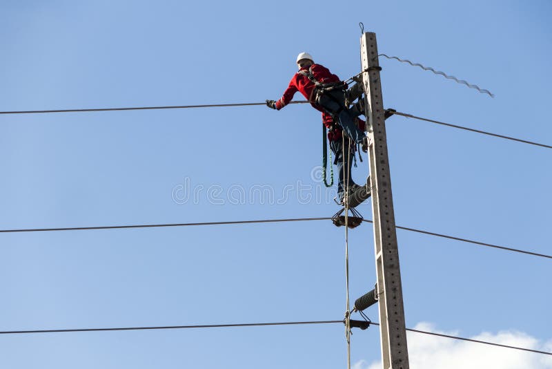 Electricians Working on a Pylon Stock Image - Image of blue, pylon ...