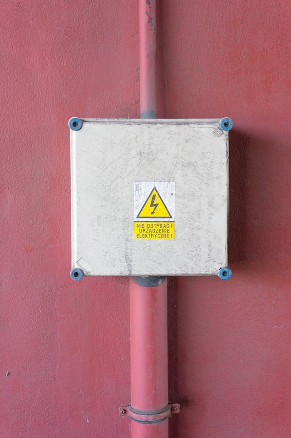 Electricity Box with Warning Sticker by a Green Bush. Stock Photo ...