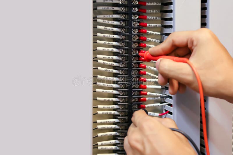 Engineer Use Meter Checking Electric Current Voltage at Terminal Block ...