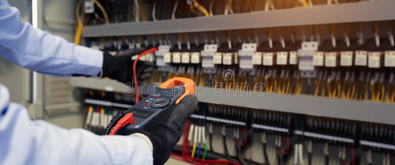 Engineer Use Meter Checking Electric Current Voltage at Terminal Block ...