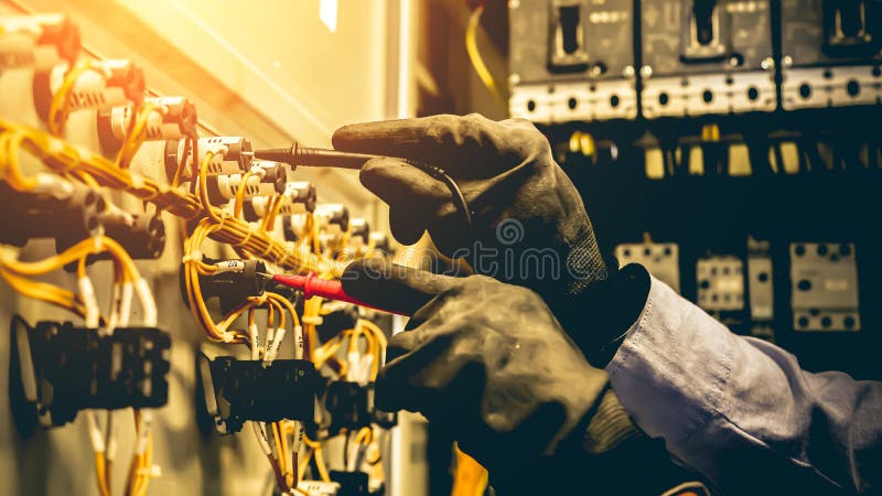 Engineer Use Meter Checking Electric Current Voltage at Terminal Block ...