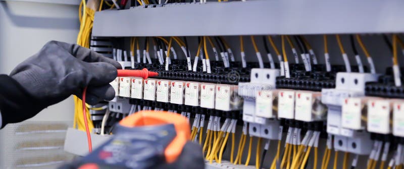 Engineer Using Measuring Equipment Checking Electric Current Voltage at ...