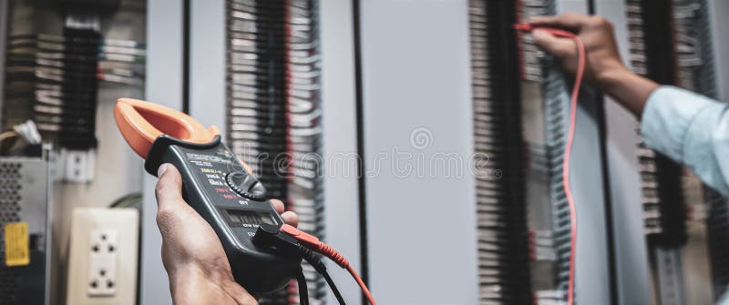 Engineer Using Measuring Equipment Checking Electric Current Voltage at ...