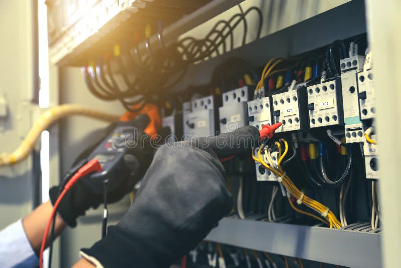 Engineer Using Measuring Equipment Tool Checking Electric Current ...