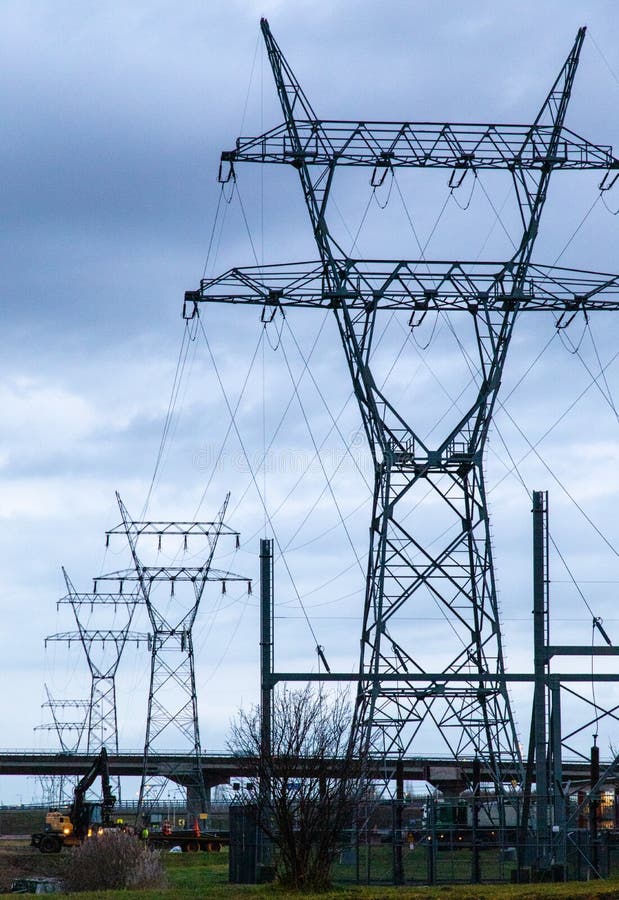 Steel Masts Of High Voltage Power Lines At The Plant. Electrical ...