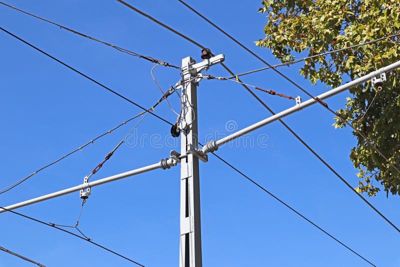 Electricity Metal Pole Against Blue Sky and Tree Leaves Stock Photo ...