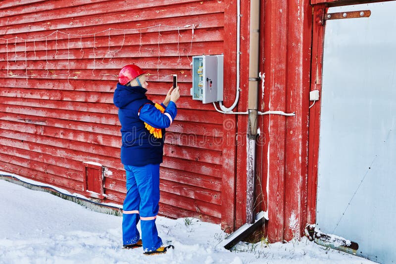 Electricity Meter Inspector Adjusting Components in Meter Box. Stock ...
