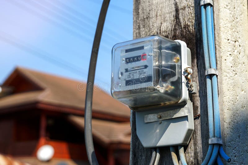 Electricity Meter is Installed on a Light Pole in Front of the House ...