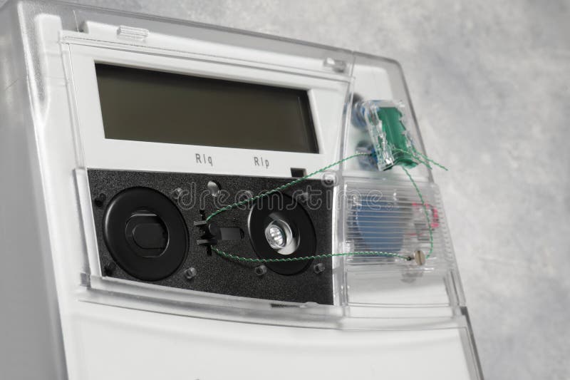 Electricity Meter on Light Grey Wall, Closeup Stock Image - Image of ...