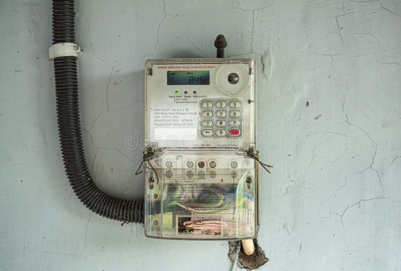 An Electricity Meter is Mounted on a Wall. Electric Meter Stock Photo ...