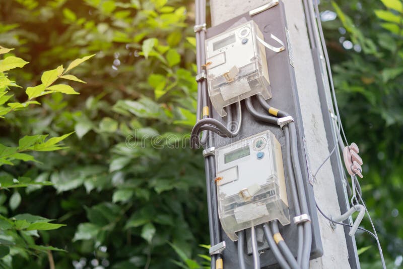 The Electricity Meters is Located at the Electric Pole. Background Blur ...