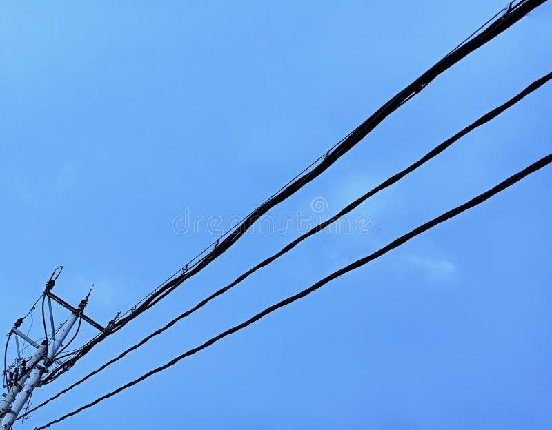 Electricity Pole with Its Wires Cables Against Clear Blue Sky ...