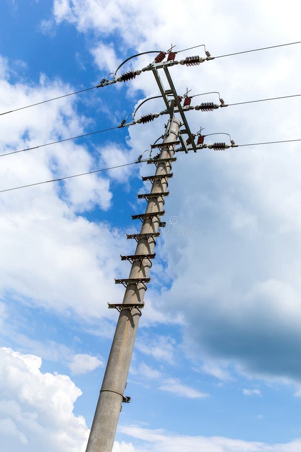 Electricity Pole and Threads Against Blue Sky. Electricity Distribution ...