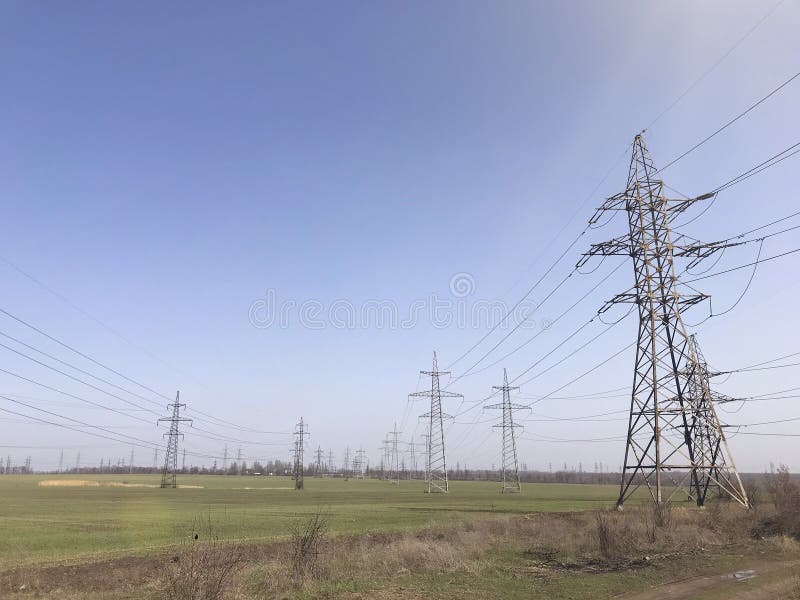 Electricity Poles in a Field. Electricity Power Concept Stock Image ...