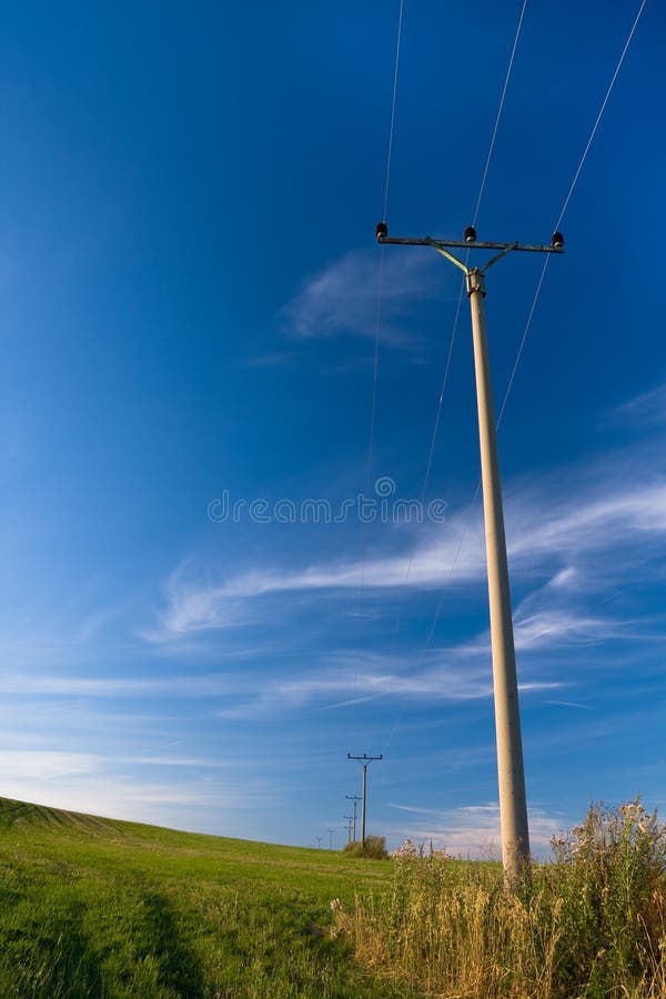 Electricity pylons line stock photo. Image of pylons - 16784144