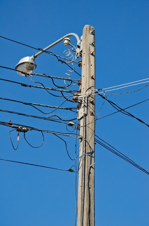 Electricity Post in Blue Sky with Bird on Cable Stock Photo - Image of ...