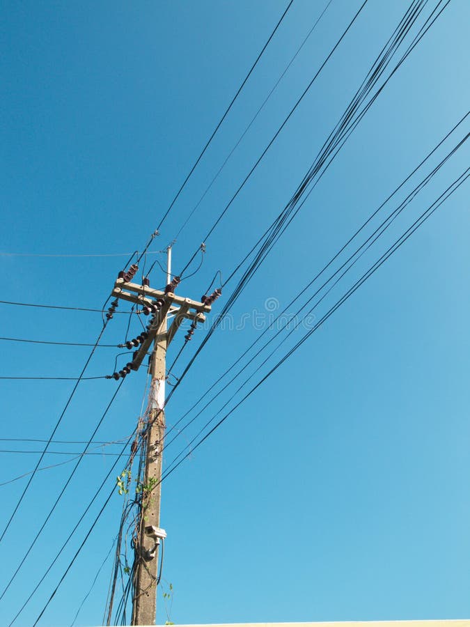 Electricity Post Against Bright Blue Sky Editorial Stock Image - Image ...