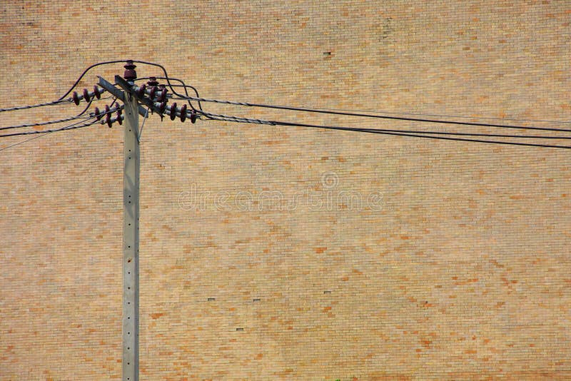 Electricity Post and Wire on the Brick Wall Stock Photo - Image of ...