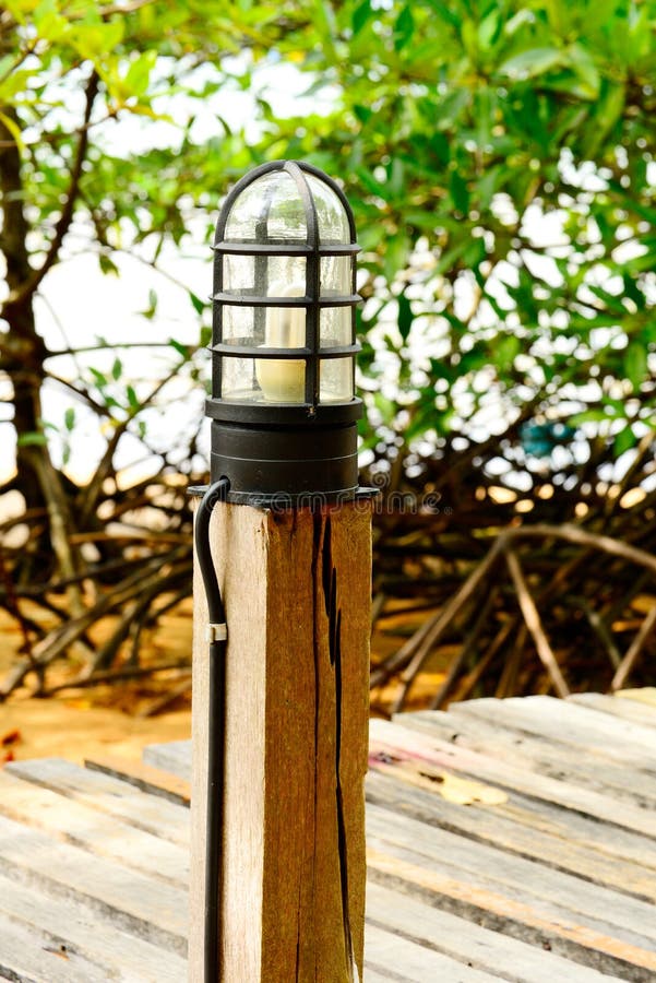 Electricity Post on Wood Bridge Stock Photo - Image of illuminated ...