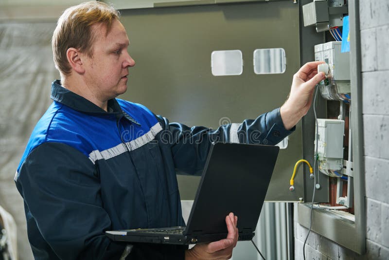 Electricity Power Control and Metering. Worker Collects Data Stock ...
