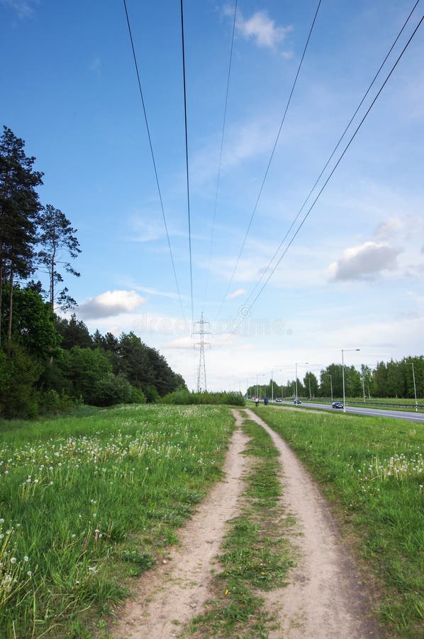 Electricity Power Lines Above Path in the Meadow Stock Photo - Image of ...