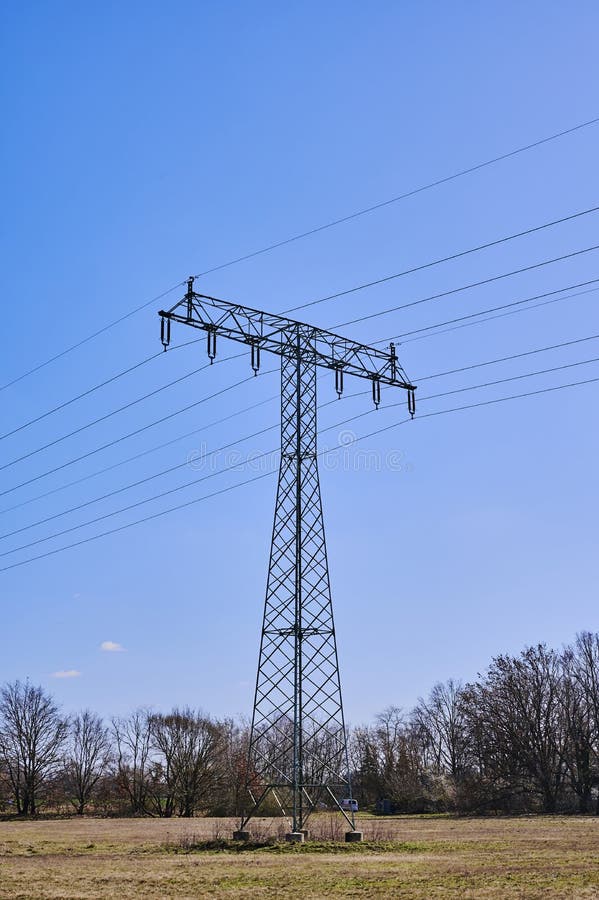 Electricity Pylon Against Blue Sky Stock Image - Image of industrial ...