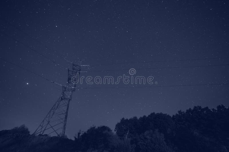 Electricity Pylon Against Night Sky Stock Photo - Image of stars ...
