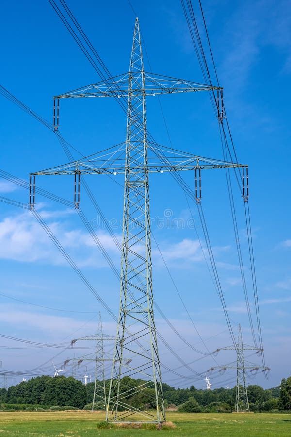 An Electricity Pylon in Front of a Blue Sky Stock Image - Image of ...