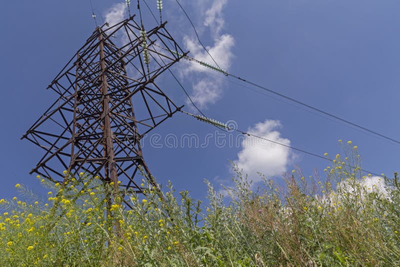 Electricity Pylon Standing in Field Stock Photo - Image of white, blue ...