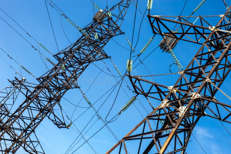 Electricity Pylons with Warning High Voltage Sign Stock Photo - Image ...