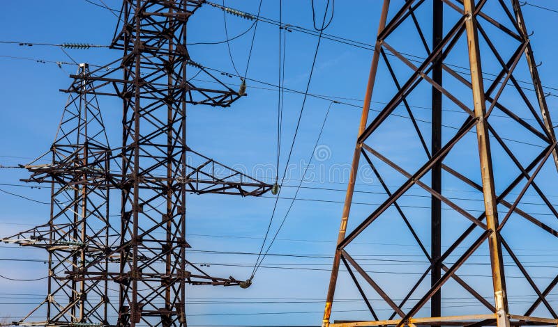 Electricity Pylons with Warning High Voltage Sign Stock Photo - Image ...
