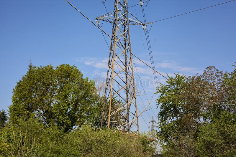 Electricity Pylons Framed by Trees with the Sky As Background Stock ...