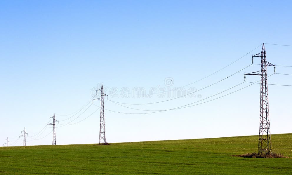 Electricity pylons line stock photo. Image of pylons - 16784144