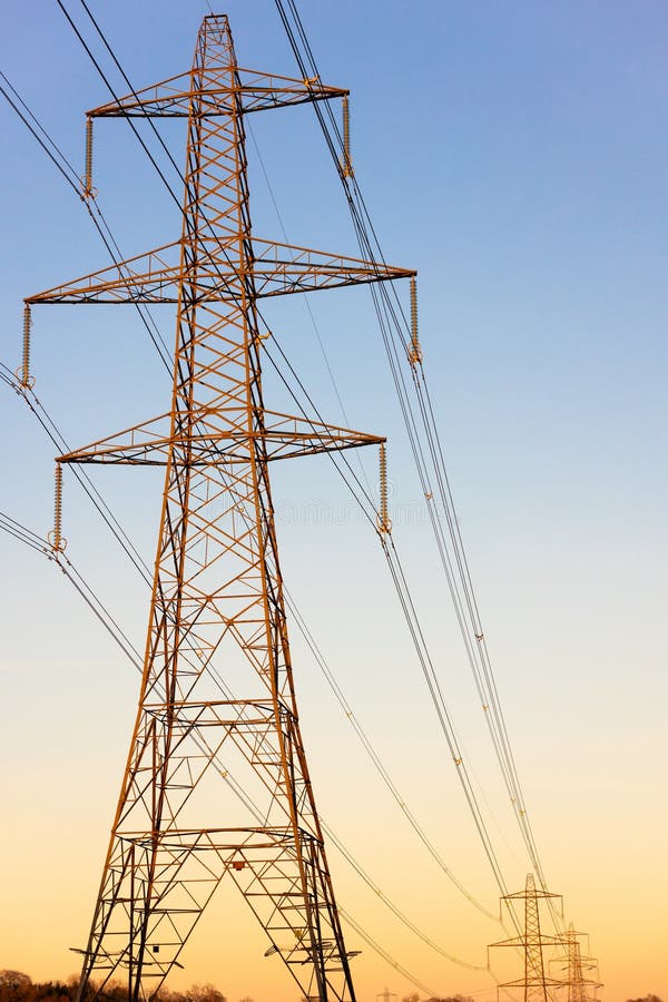 Electricity Pylons of the National Grid at Sunset or Sunrise Stock ...