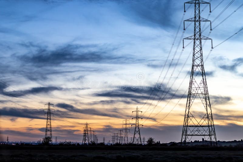 Electricity Pylons at Sunset Stock Photo - Image of power, outdoors ...