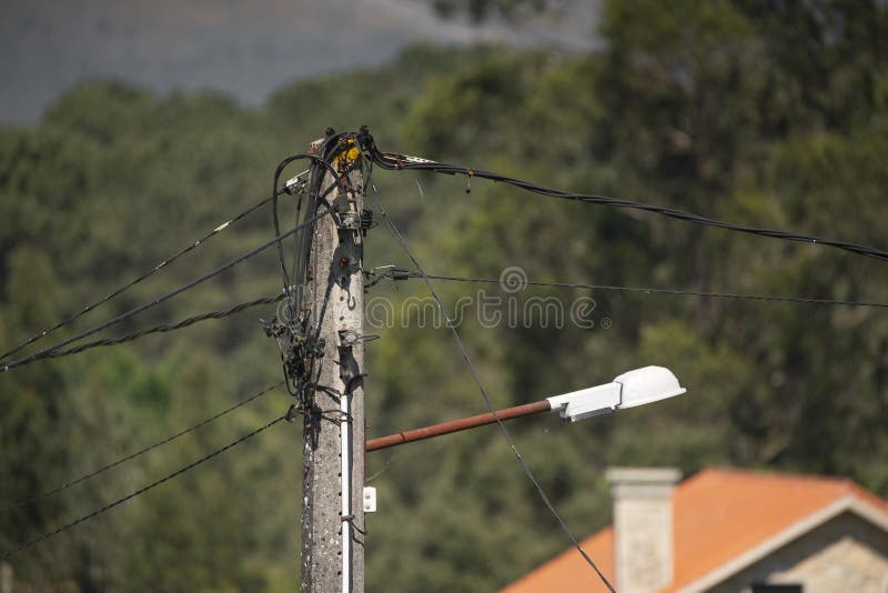 Electricity Transmission Pole with Trees in a Background Stock Photo ...