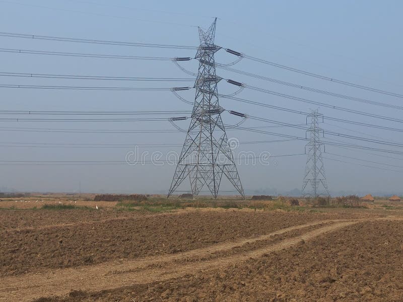 Electricity Pylon on Rural Indian Agricultural Fields with Blue ...