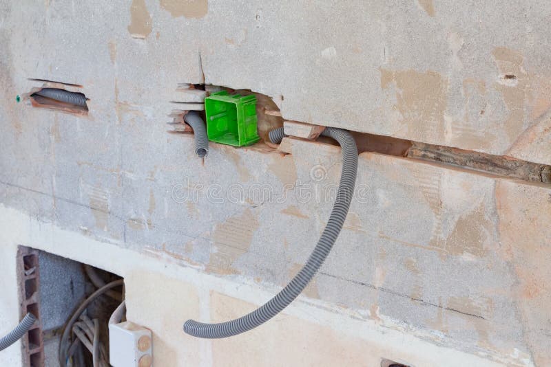 Electricity work in a wall stock photo. Image of electrical - 173937734
