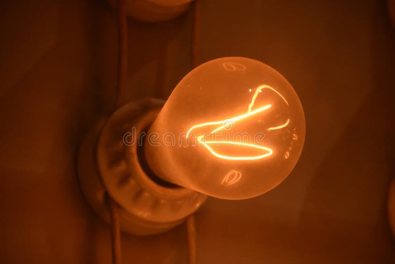 Electricty Flowing through an Old Style Lightbulb Stock Photo - Image ...