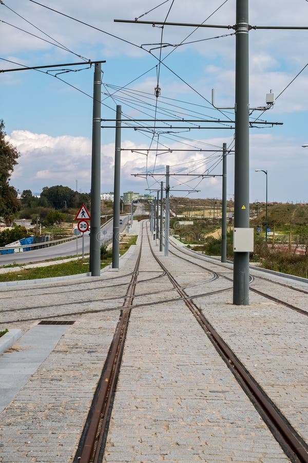 An Electrified Railway Track among Green Meadows and Wheat Fields. a ...