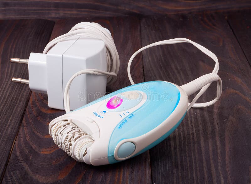 Electro Depilator on Wooden Table Stock Photo - Image of depilating ...