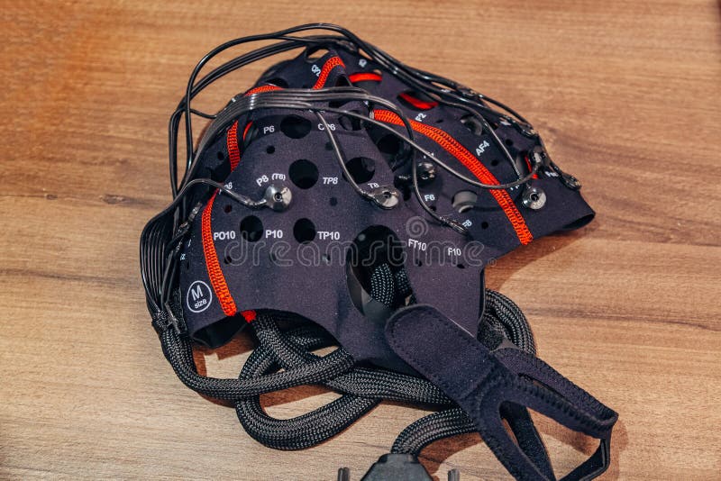The Electroencephalogram EEG Head Cap on Wooden Table Stock Image ...