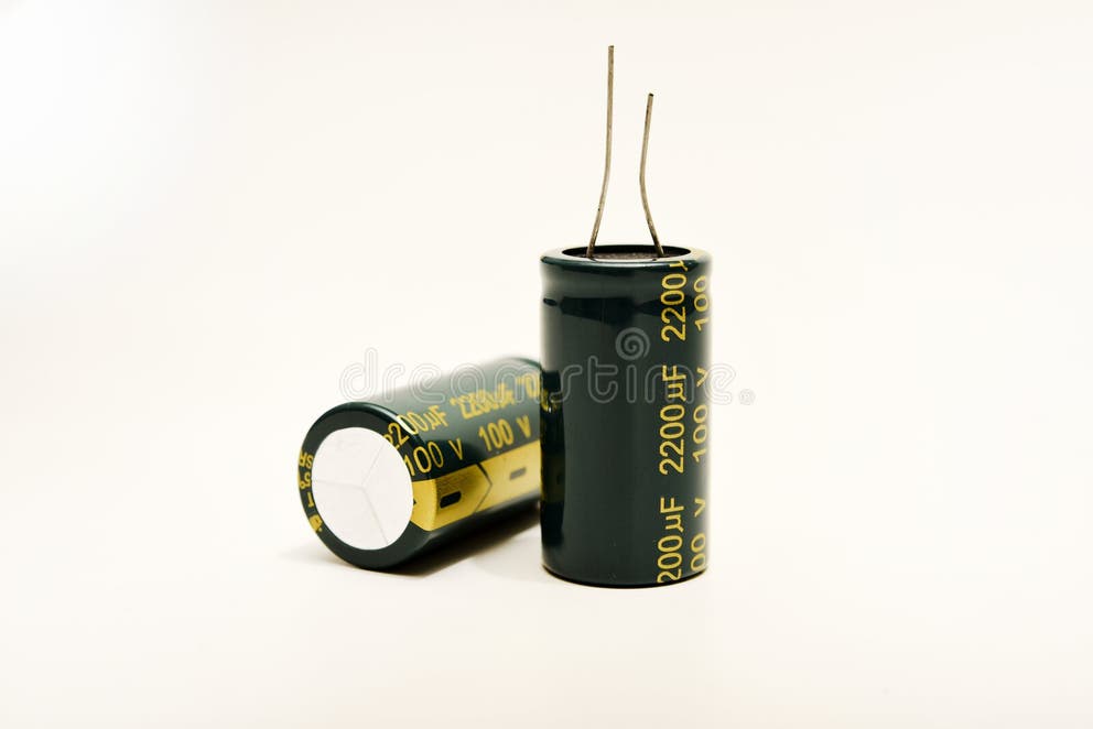 Electrolytic Capacitors on a White Background. Electronic Elements for ...