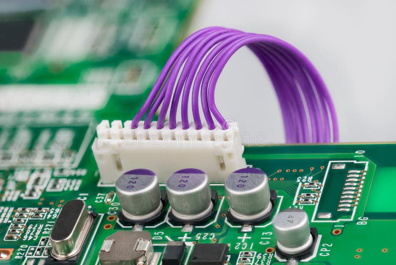 Electrolytic Capacitors and White Plastic Connector with Purple Cables ...