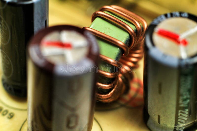 Electromagnetic Coil and Capacitors in an Electronic Board Stock Photo ...